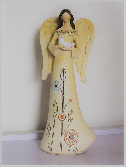 Flower Angel with floral design Holding A White Dove